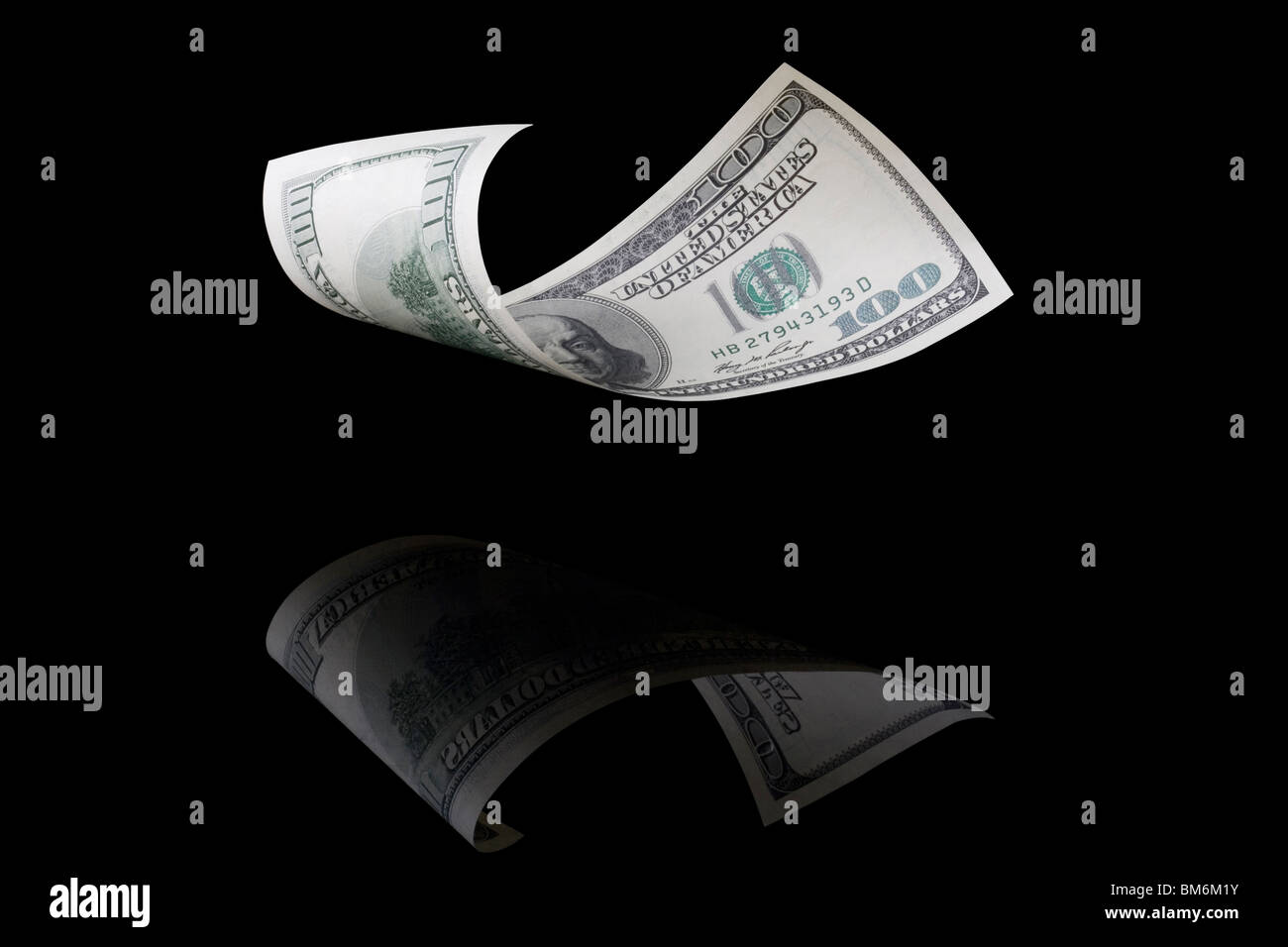 Falling hundred dollar bill on a black background with reflection Stock ...