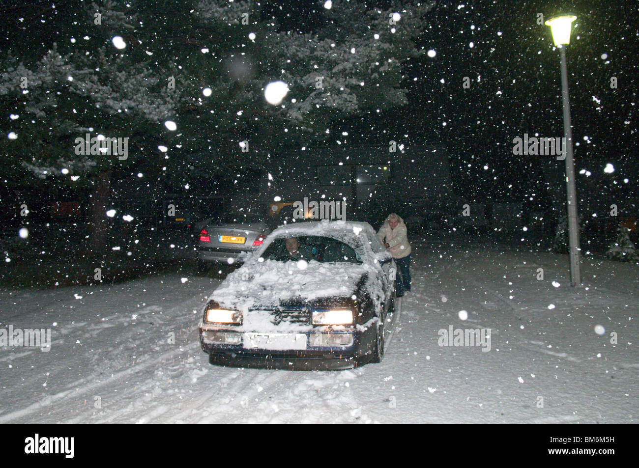 car being pushed in heavy snow at night Stock Photo - Alamy