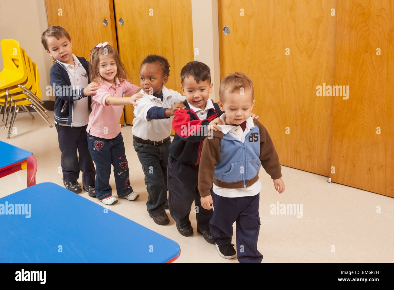 Line up of children hi-res stock photography and images - Alamy