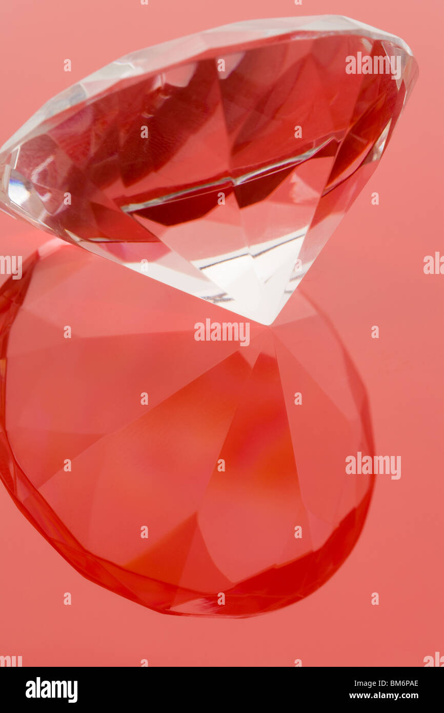 Diamond close up shot with red background Stock Photo - Alamy