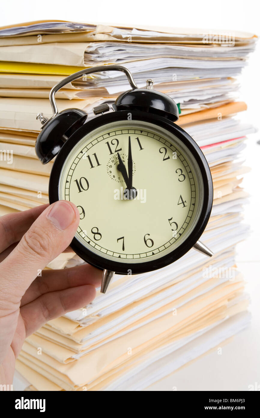 File Stack and clock with white background Stock Photo - Alamy