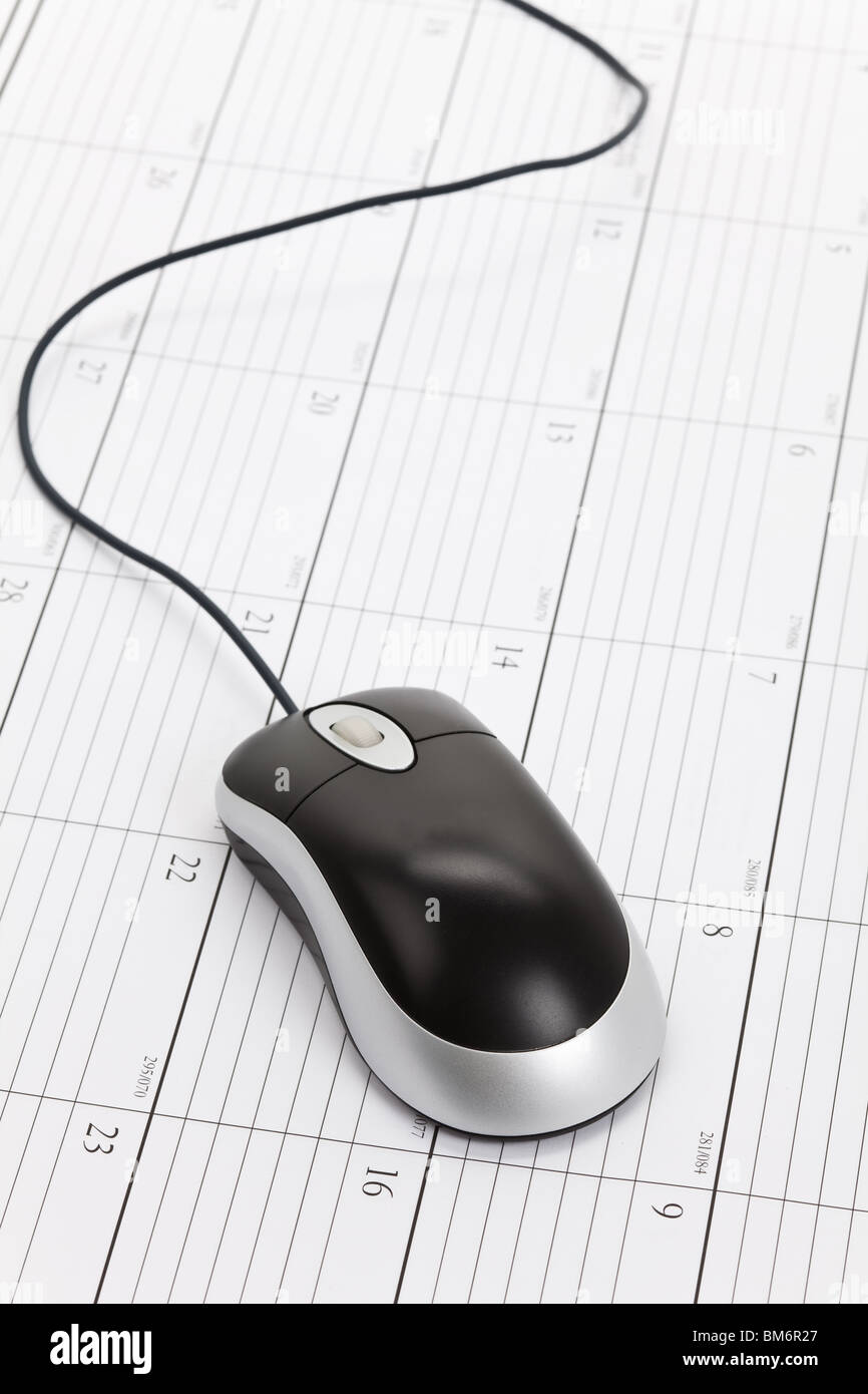 Computer Mouse and Calendar close up Stock Photo - Alamy