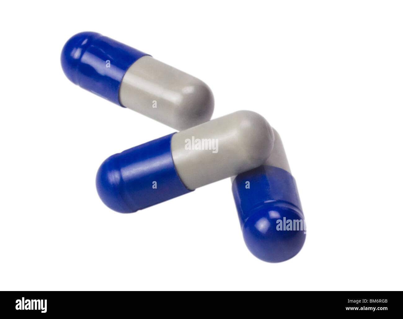 Close-up of three capsules Stock Photo - Alamy