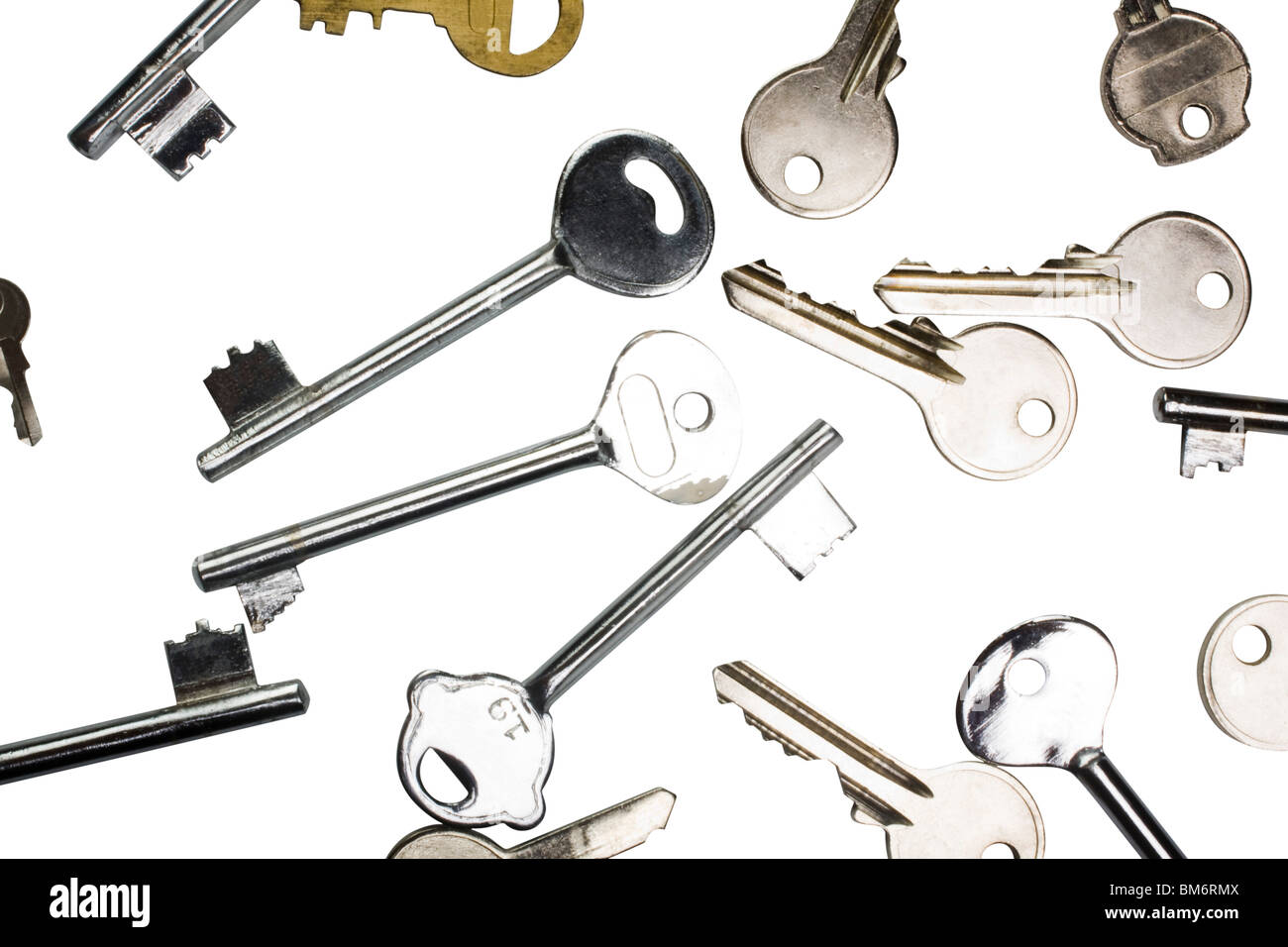 Assorted keys on white background Stock Photo - Alamy