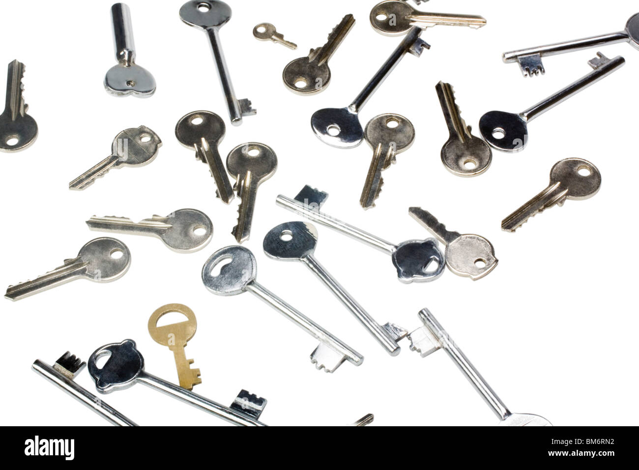 Assorted keys on white background Stock Photo - Alamy