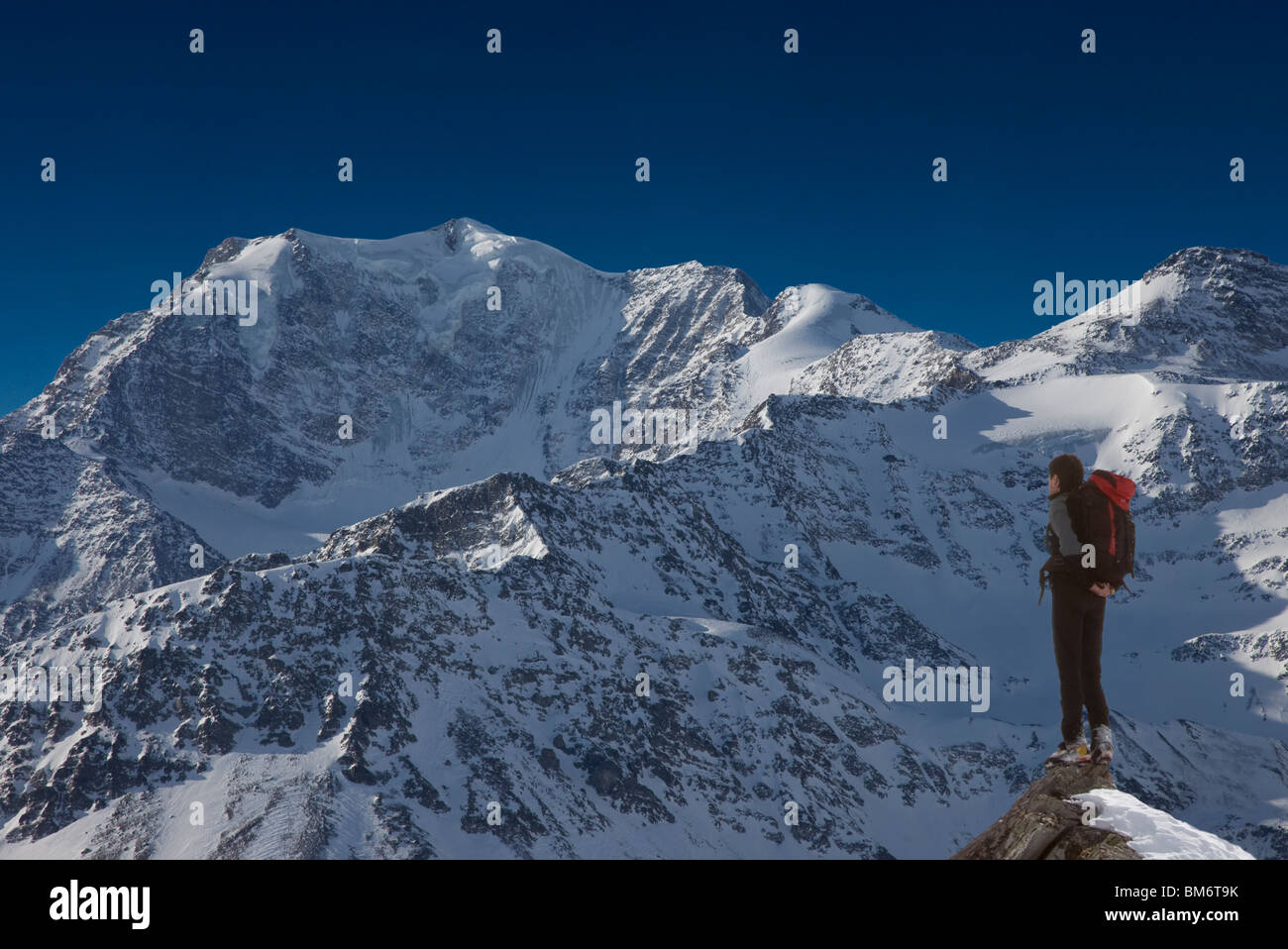 Switzerland. Canton Wallis. Alps. Climber watching Fletschorn Stock ...