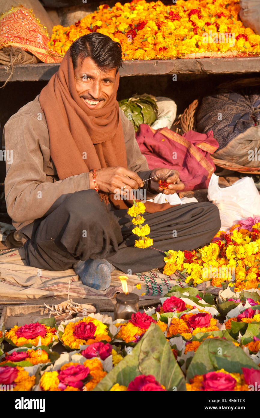 A Man selling flowers on the streets of India Stock Photo - Alamy