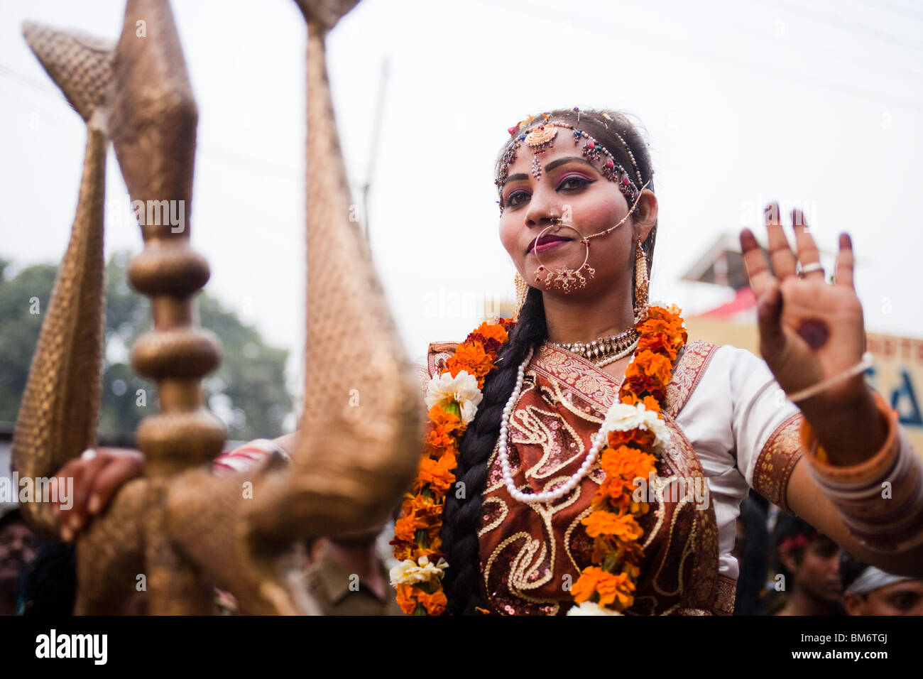 Female dancer during a street procession at the Kumbh mela, India 2010 ...