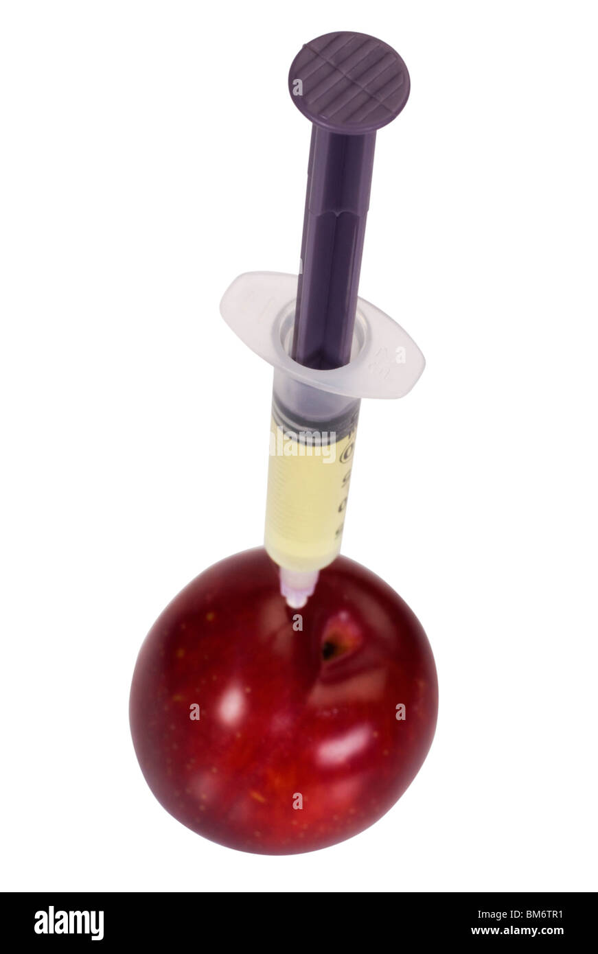 Syringe being injected into a plum Stock Photo - Alamy