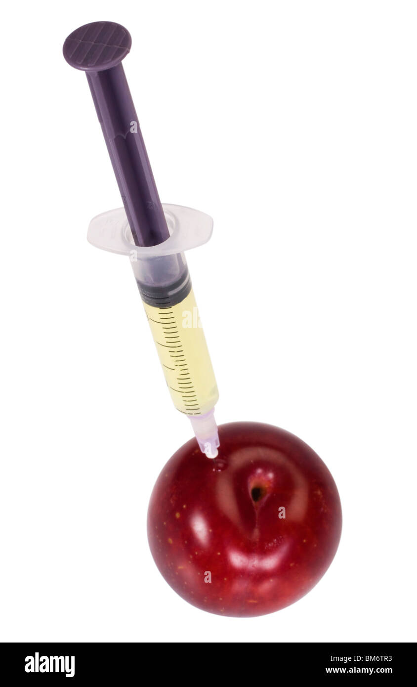 Syringe being injected into a plum Stock Photo - Alamy