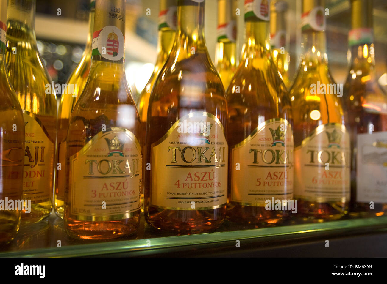 Glass bottles of alcohol on shop shelves Stock Photo - Alamy