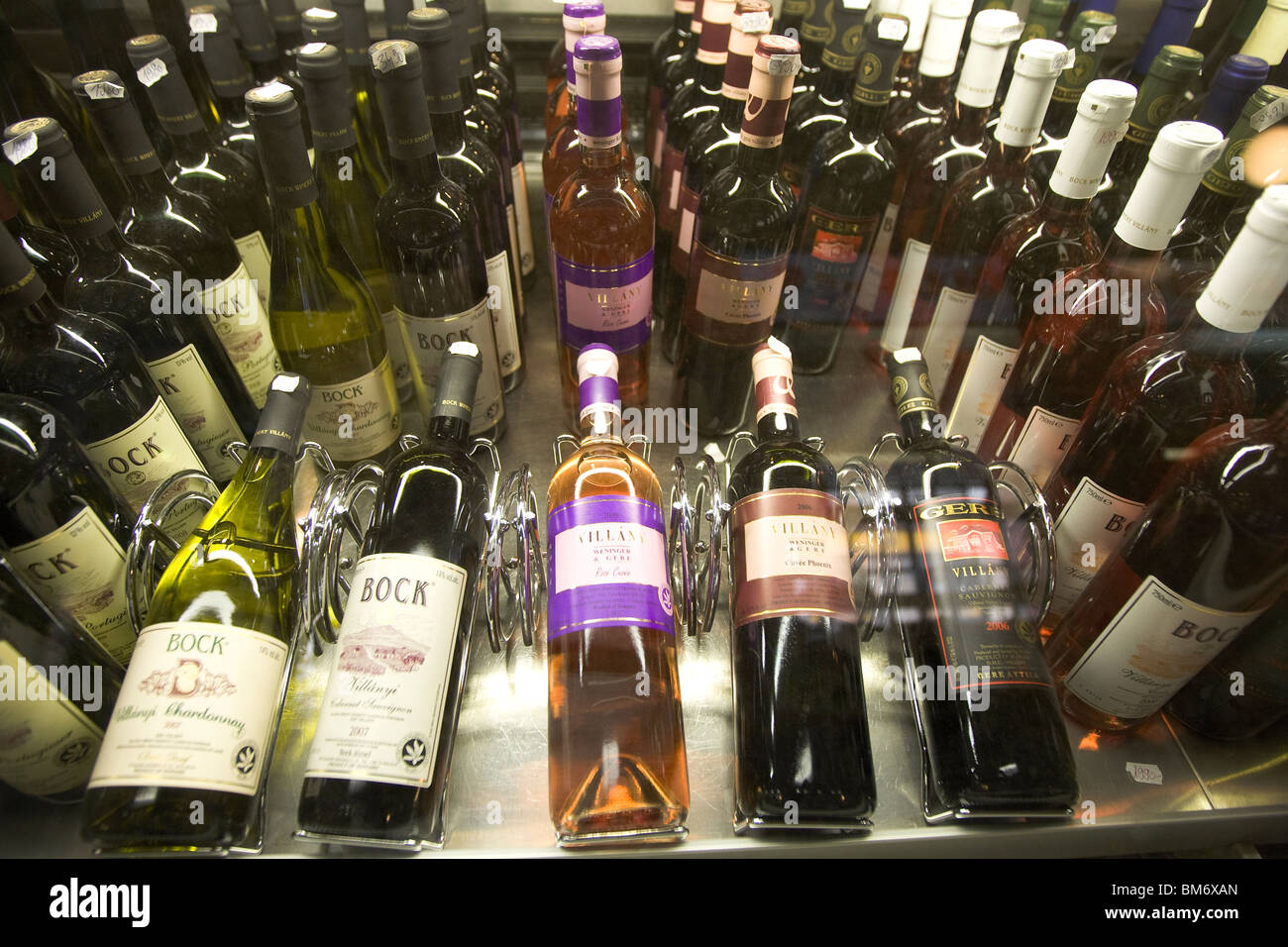 Glass bottles of alcohol on shop shelves Stock Photo - Alamy