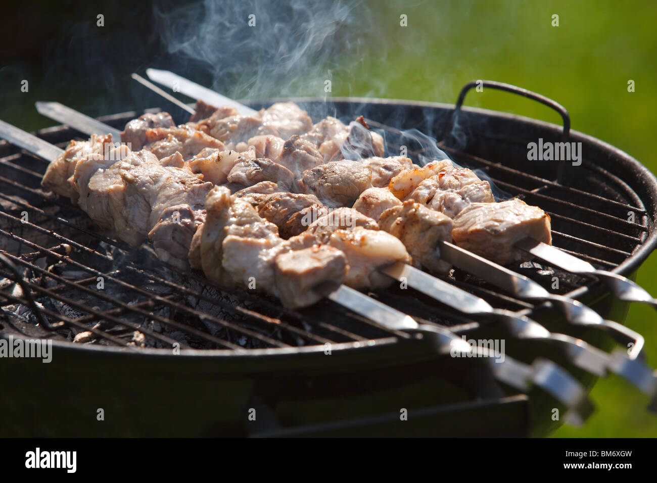 Making barbecue on he grill Stock Photo - Alamy
