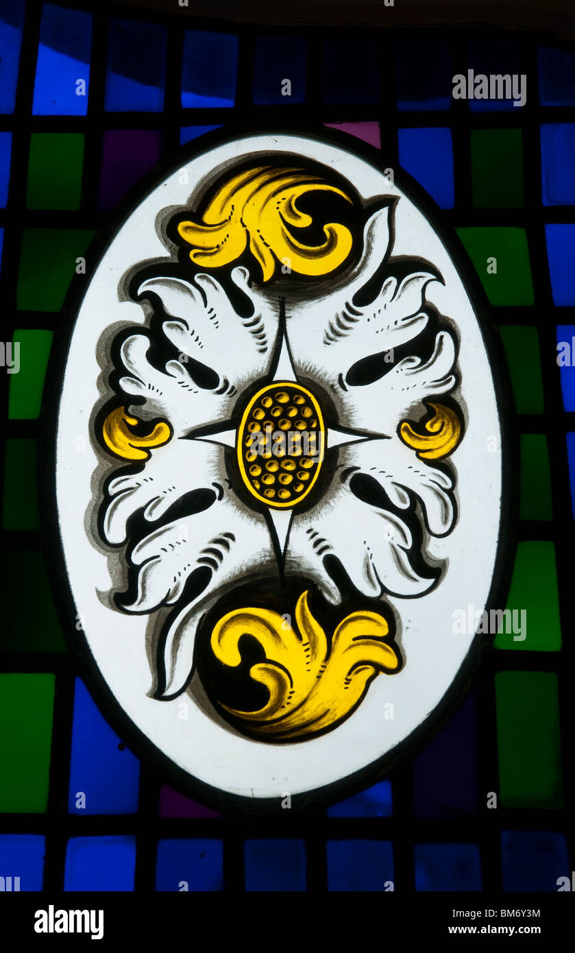 Old and bright stained glass detailwithin checked pattern Stock Photo ...