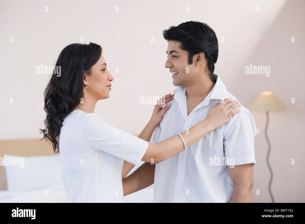 Indian couple romancing on bed hi-res stock photography and images - Alamy