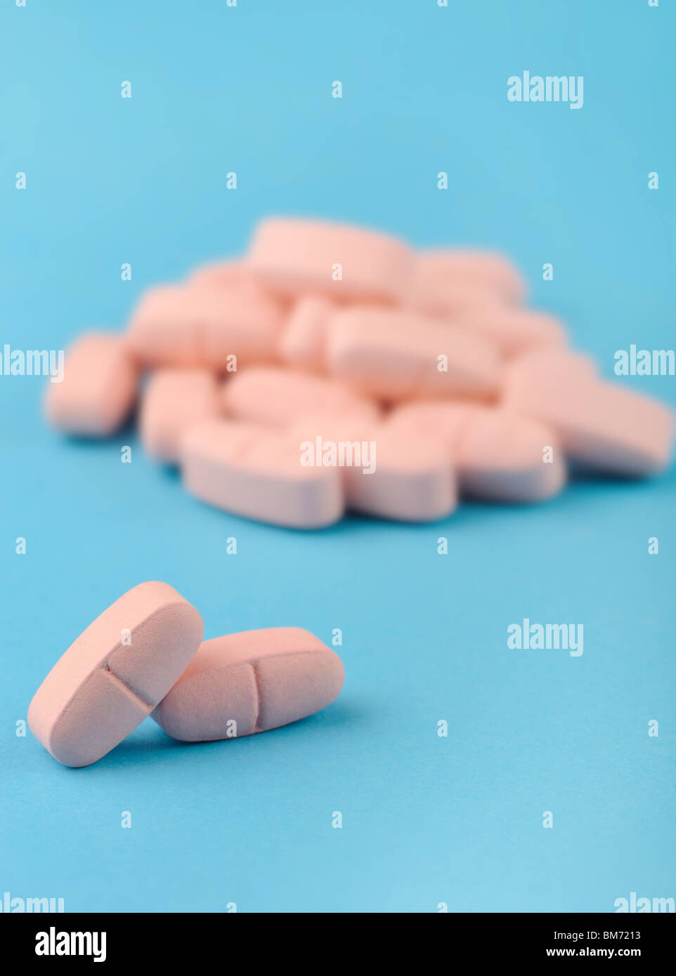 set red tablets on blue background. Photo closeup Stock Photo - Alamy