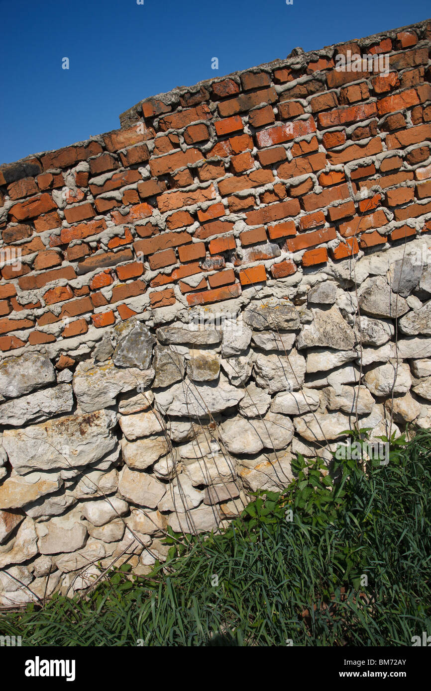 Wall made of a brick and a stone Stock Photo - Alamy