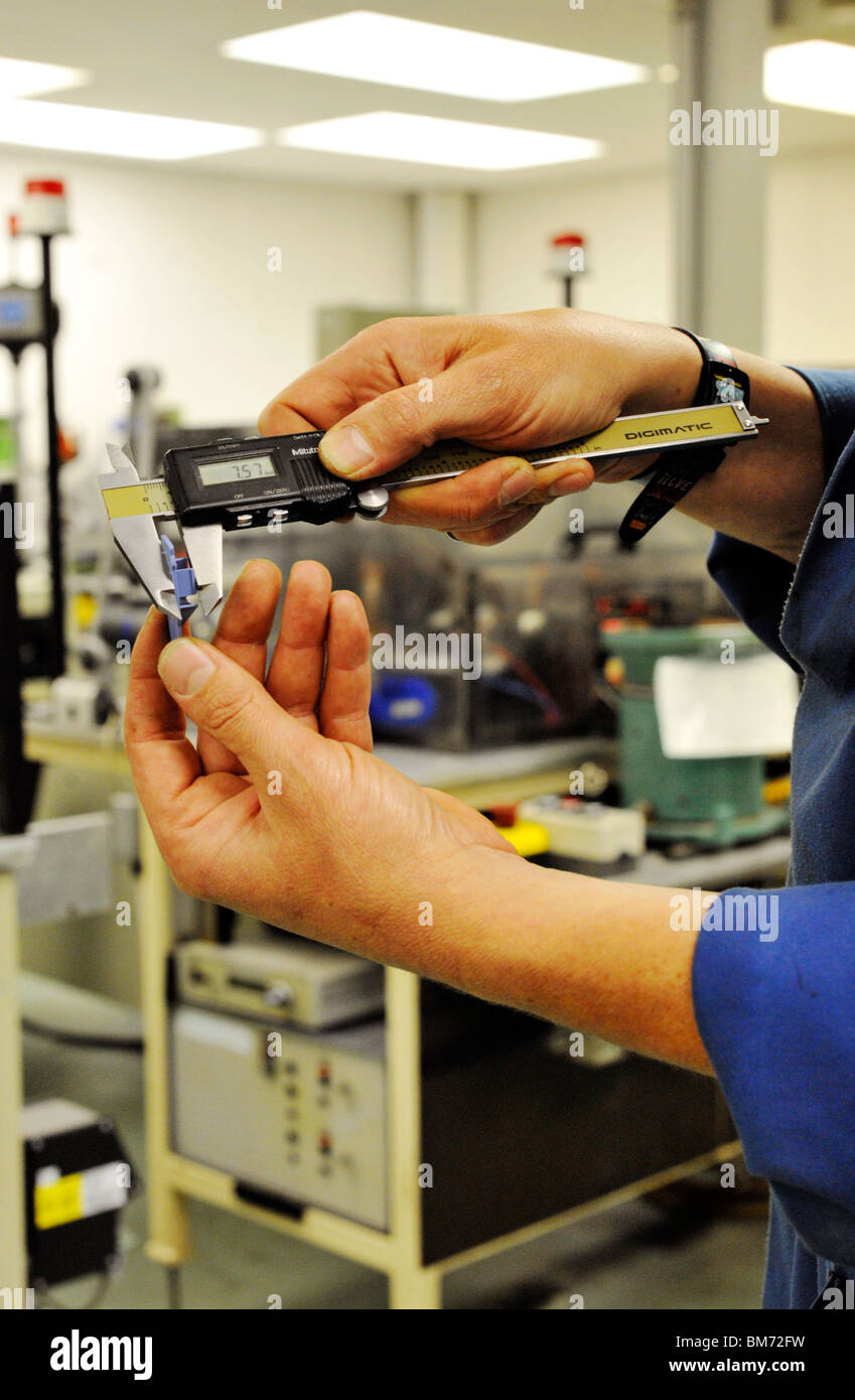 factory worker using caliper to check measurements Stock Photo - Alamy