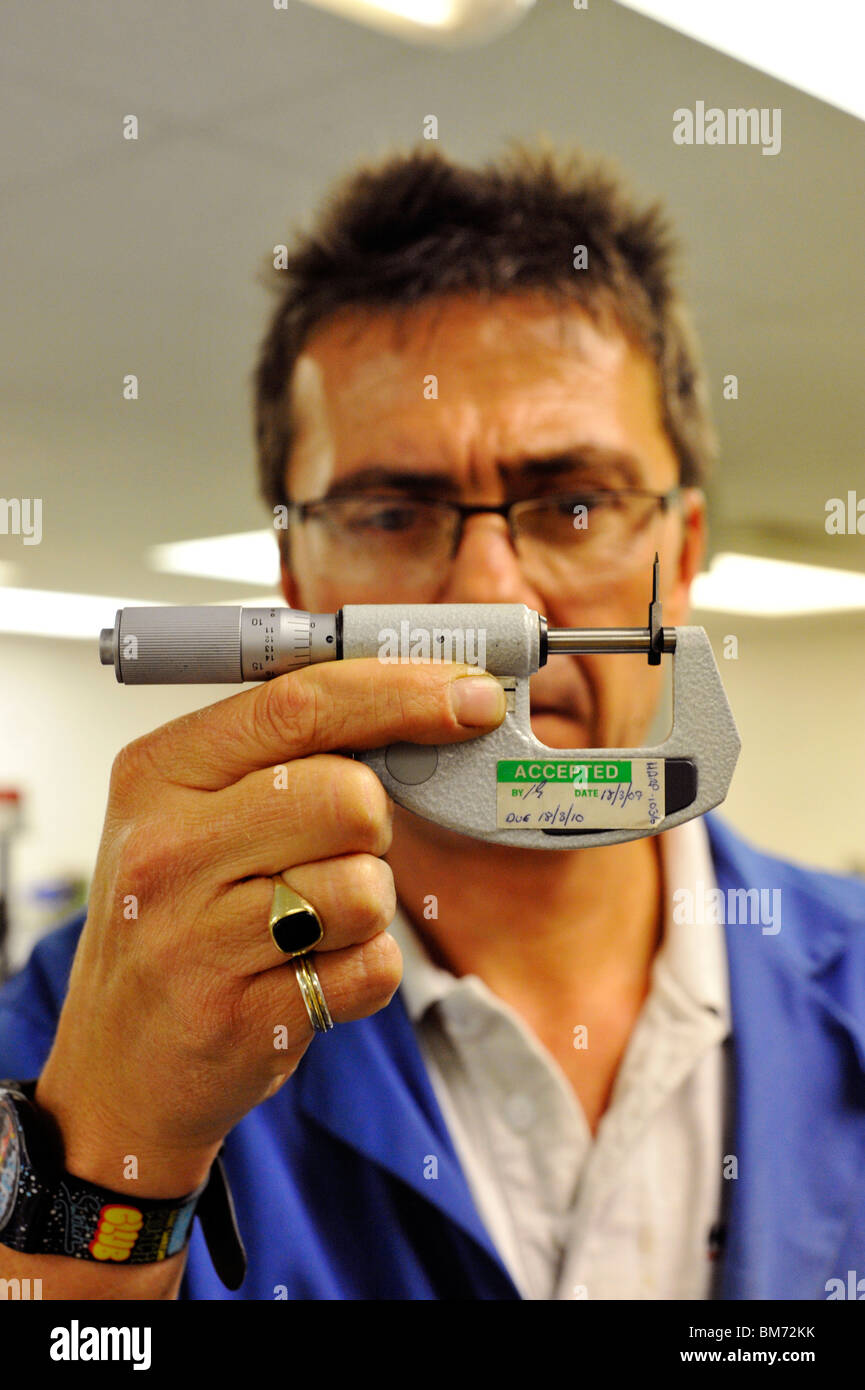 factory worker using micrometer to check measurements Stock Photo - Alamy