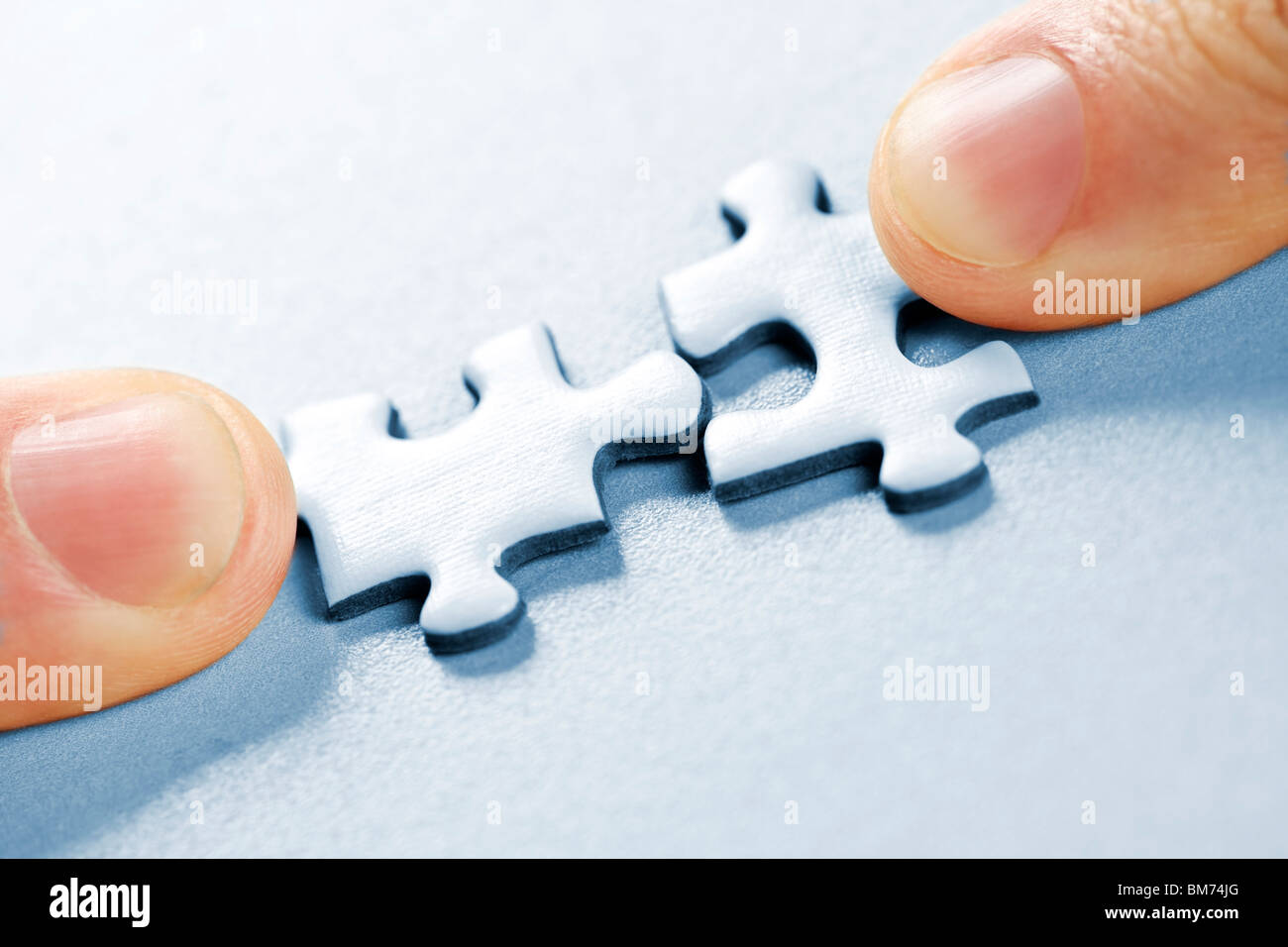 Jigsaw pieces fitting together hi-res stock photography and images - Alamy
