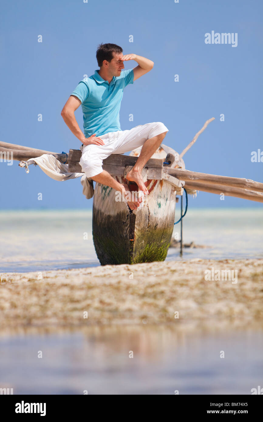 Man and boat Stock Photo - Alamy