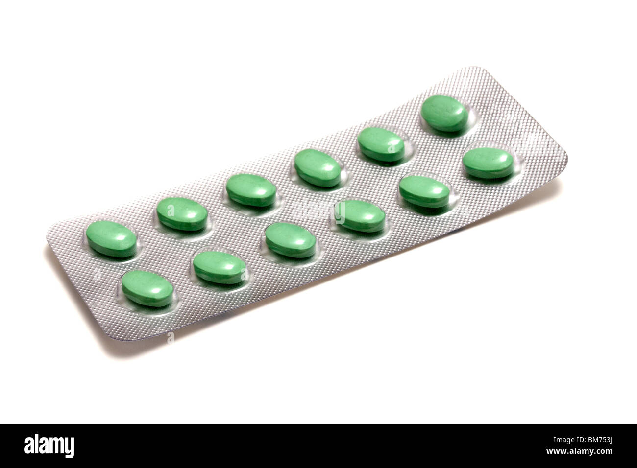 Set of green pills isolated on white background Stock Photo - Alamy