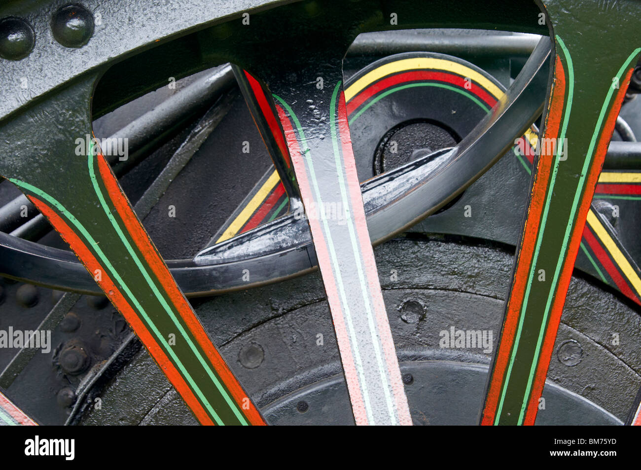 Spokes of the driving wheel of a steam traction engine showing lined ...