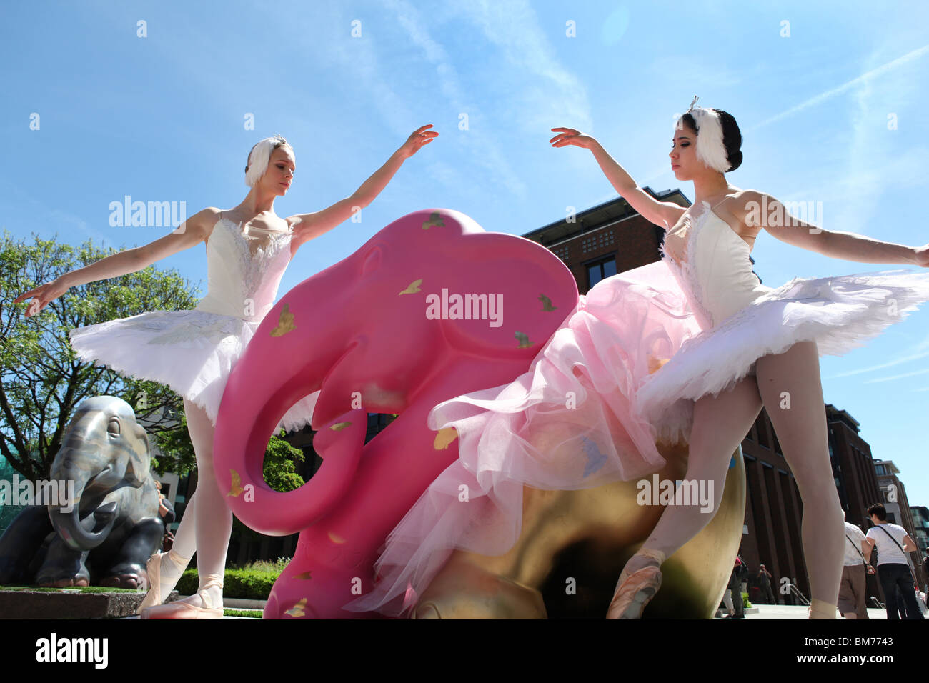Two ballerinas from the English National Ballet pose next to one of the ...