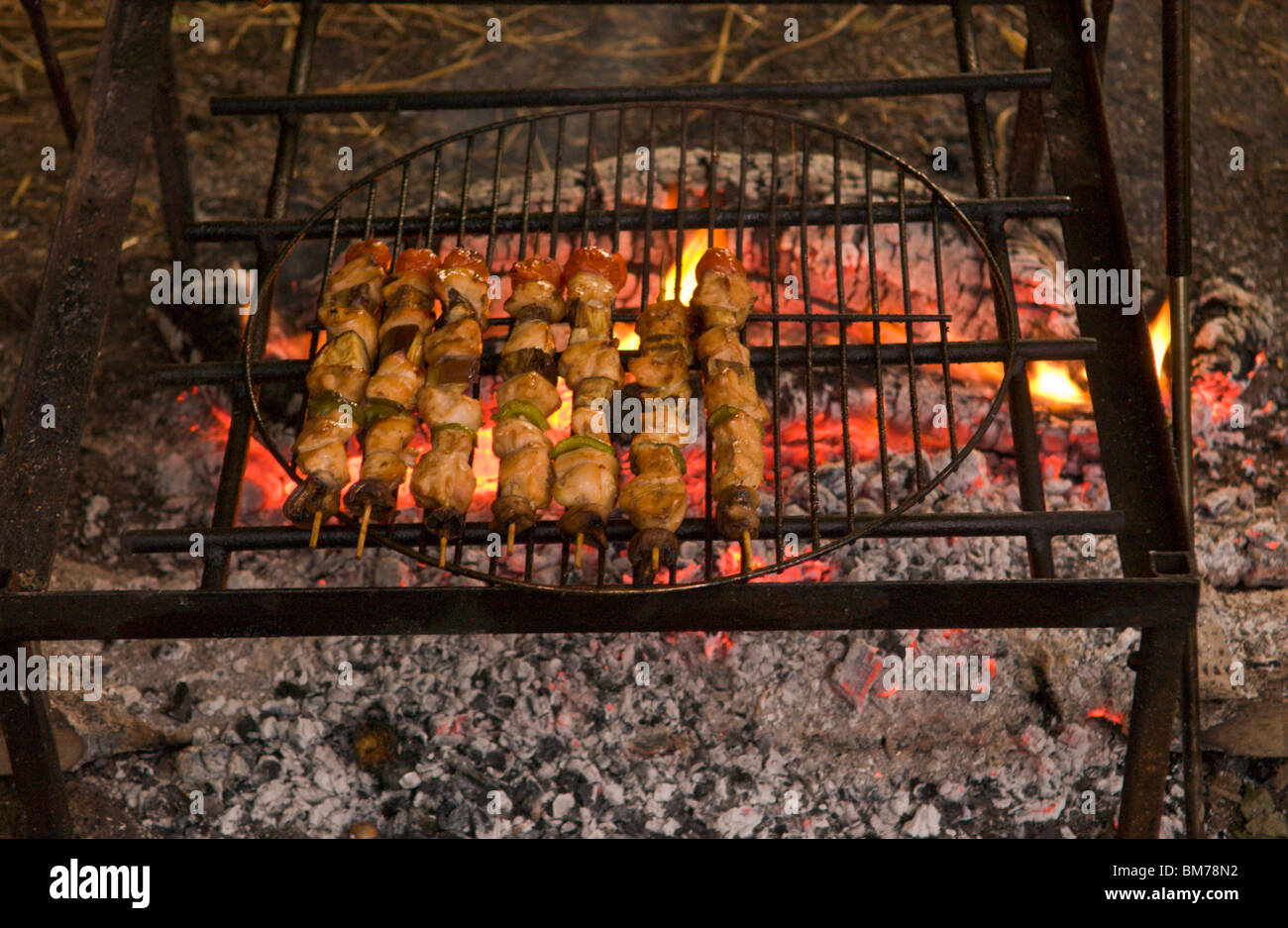 Kebabs cooking over open fire at barbecue Gower Swansea South Wales UK ...