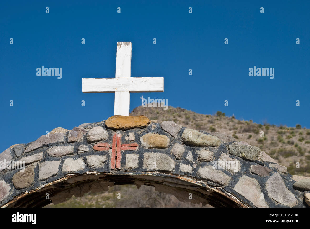 Two crosses on a garden gate lead one's eye to the cross at the end of ...
