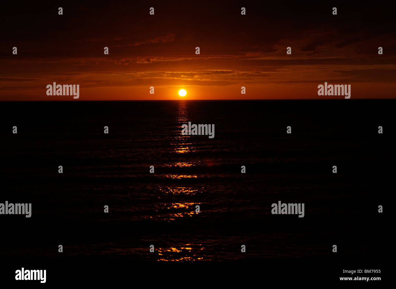 Al orange sunset over Lake Michigan in Holland Michigan outside horizon ...