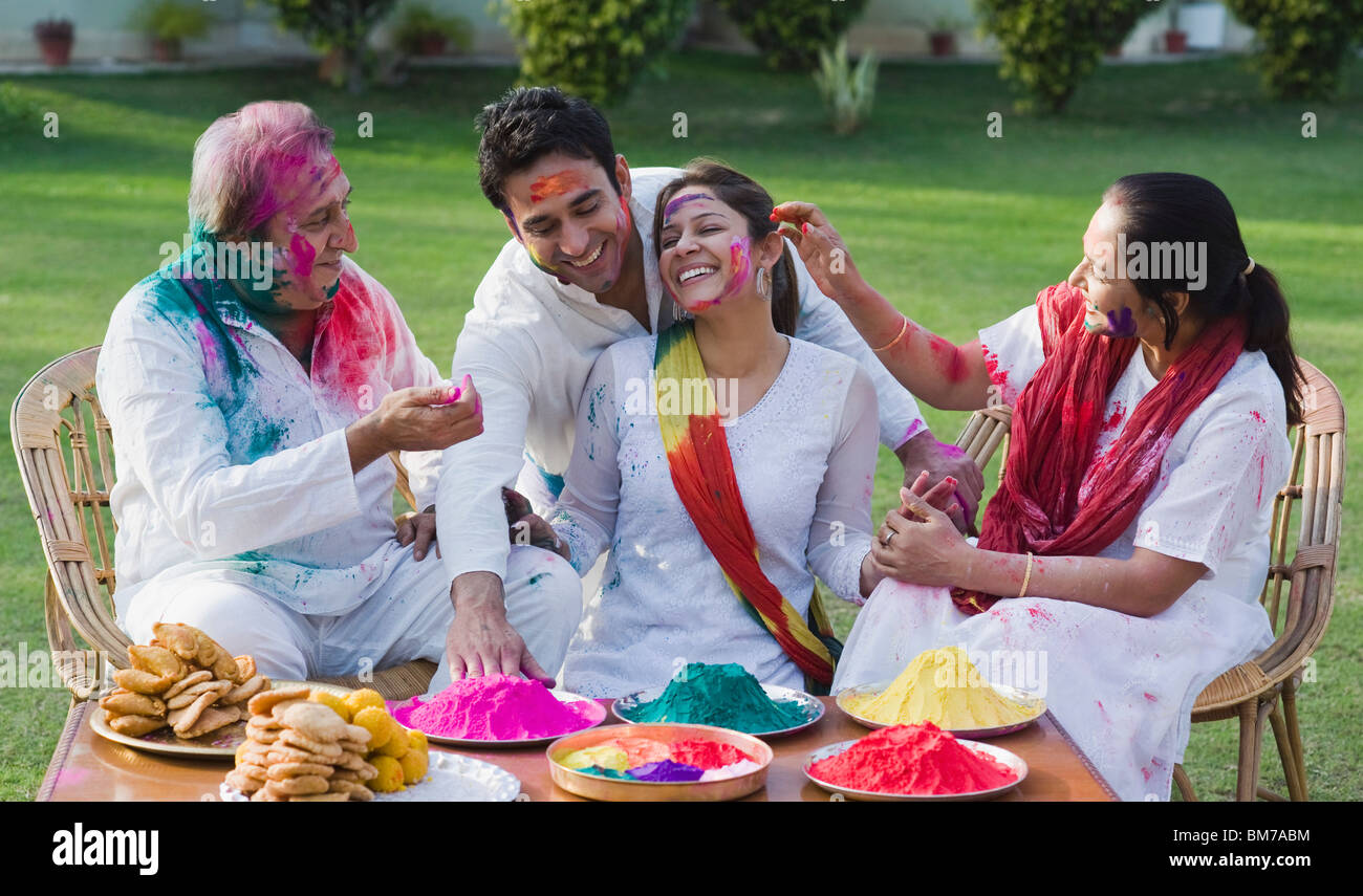 Family celebrating holi Stock Photo - Alamy