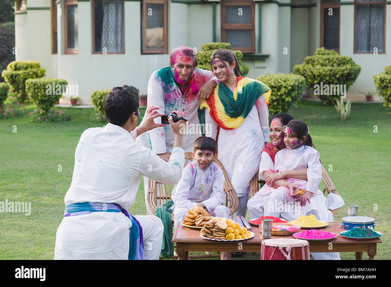 Man filming his family with a home video camera on holi Stock Photo - Alamy