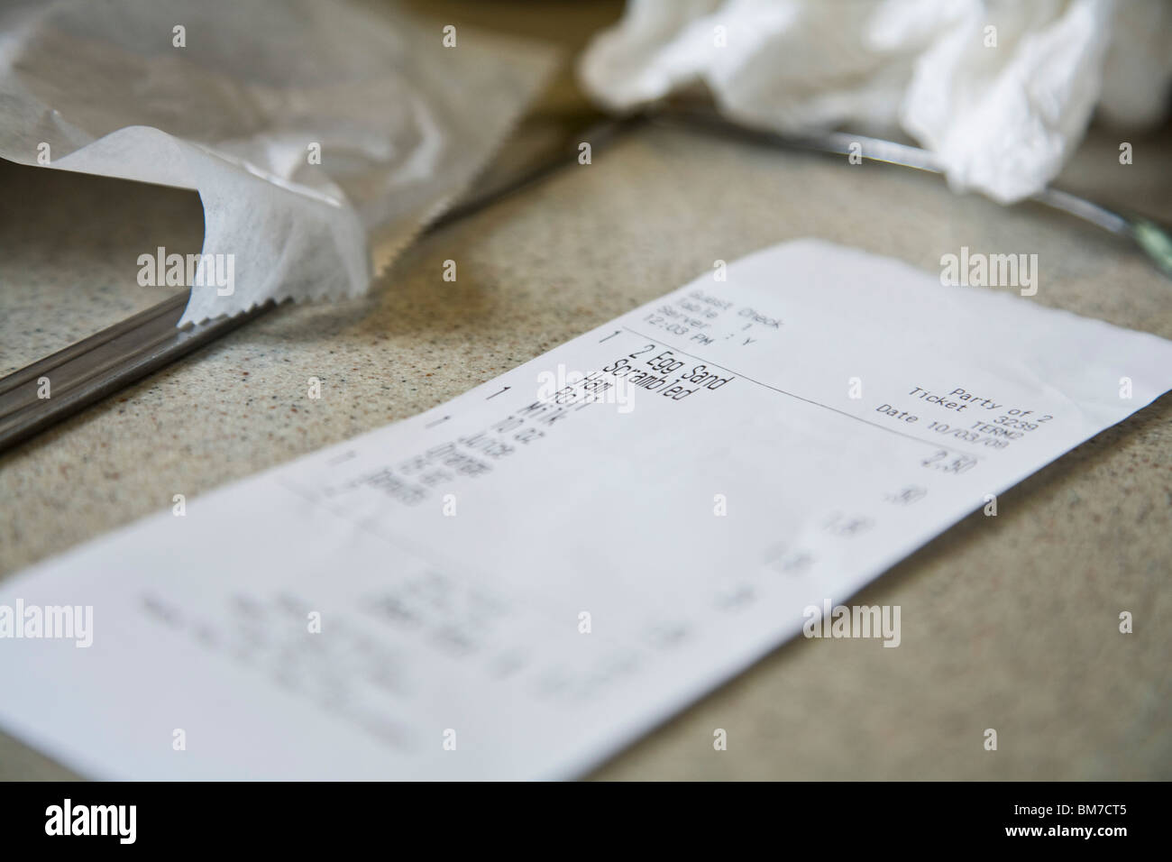 Detail of a cafe receipt on a counter Stock Photo - Alamy