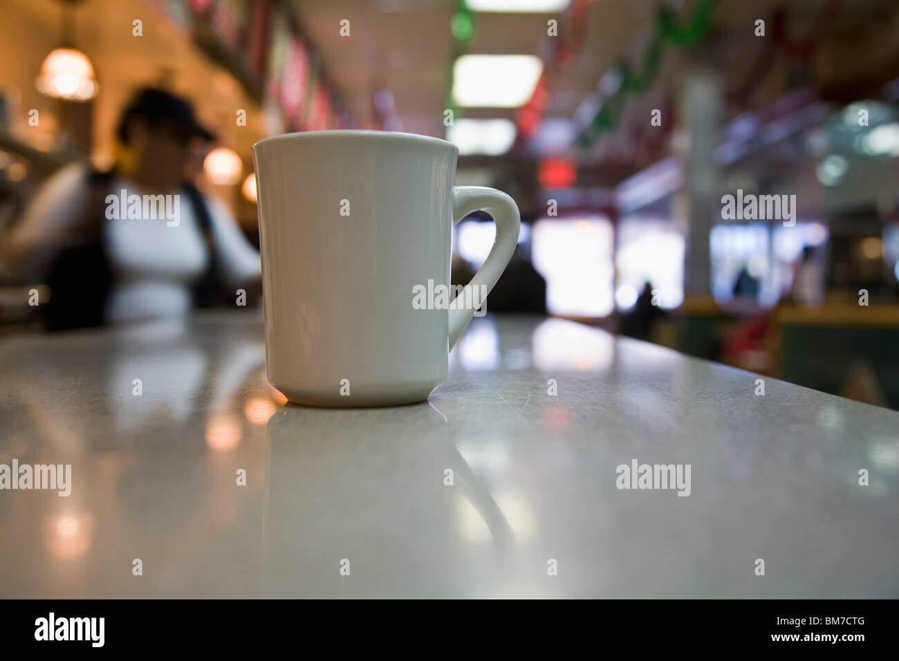 A coffee cup on a diner counter Stock Photo - Alamy
