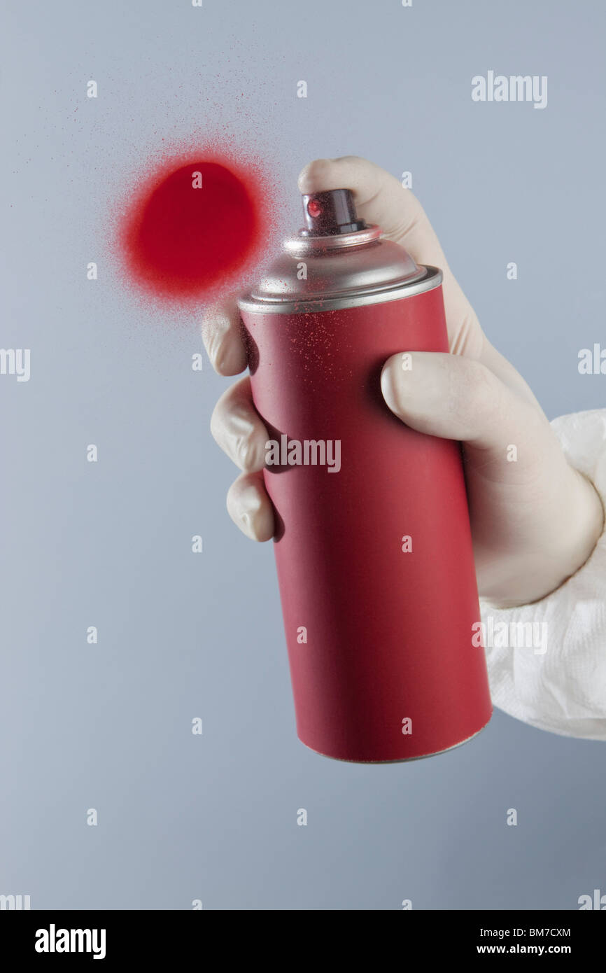Detail of a hand spray painting Stock Photo - Alamy