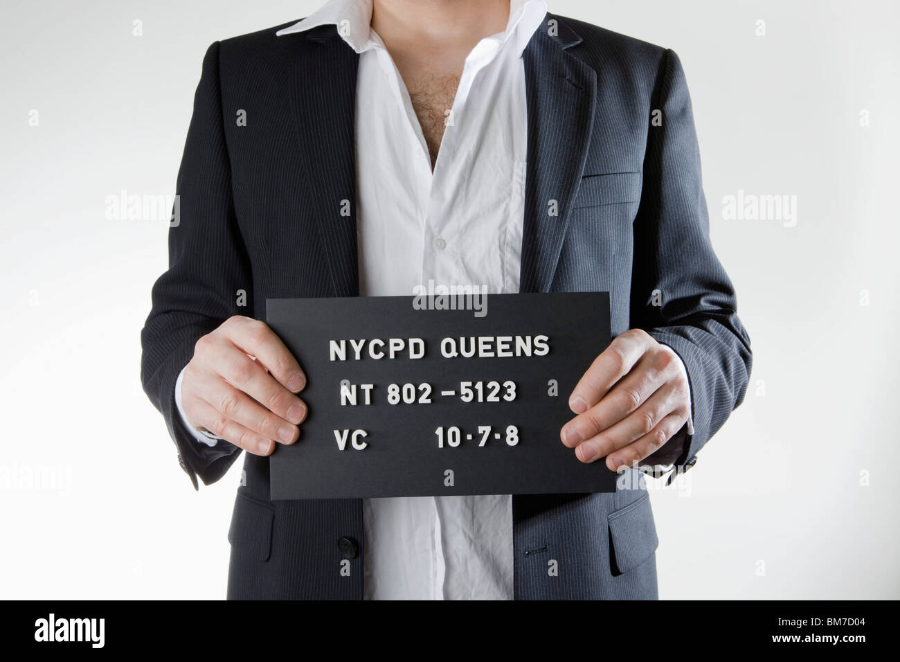 Midsection of a man posing for a mug shot Stock Photo - Alamy