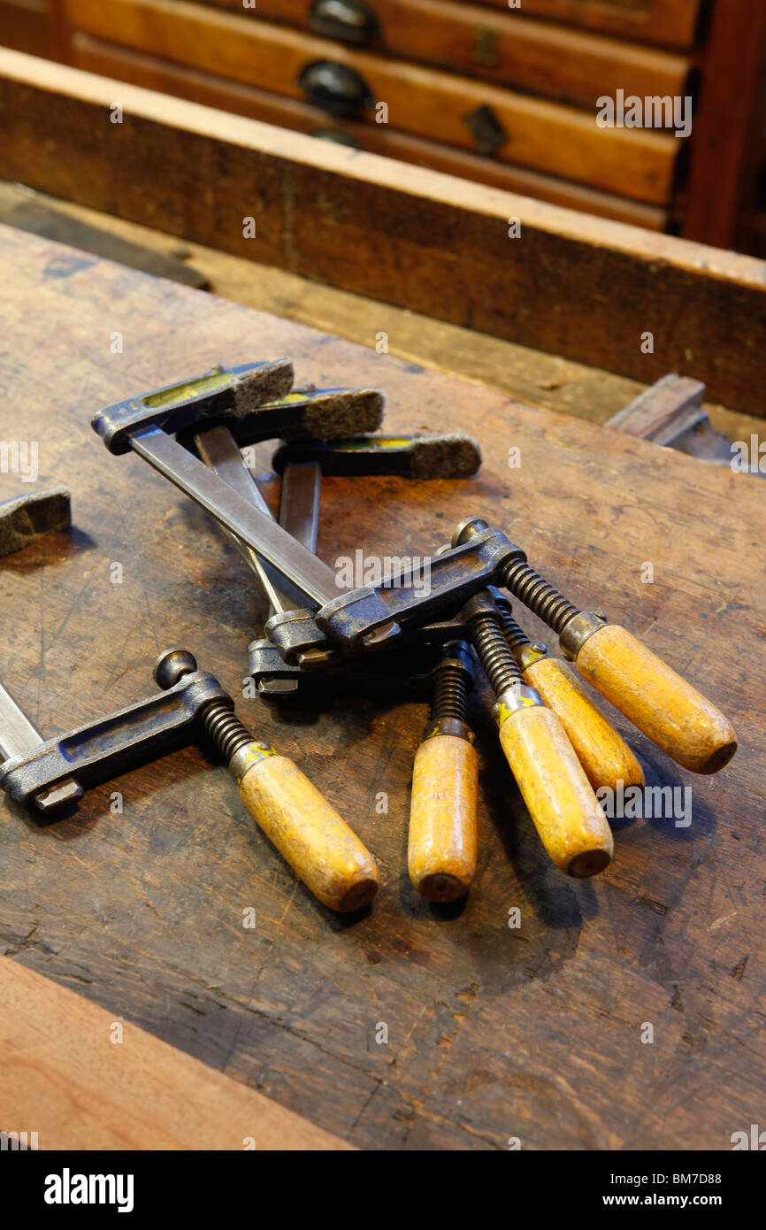 Clamps on a bench in a workshop Stock Photo - Alamy