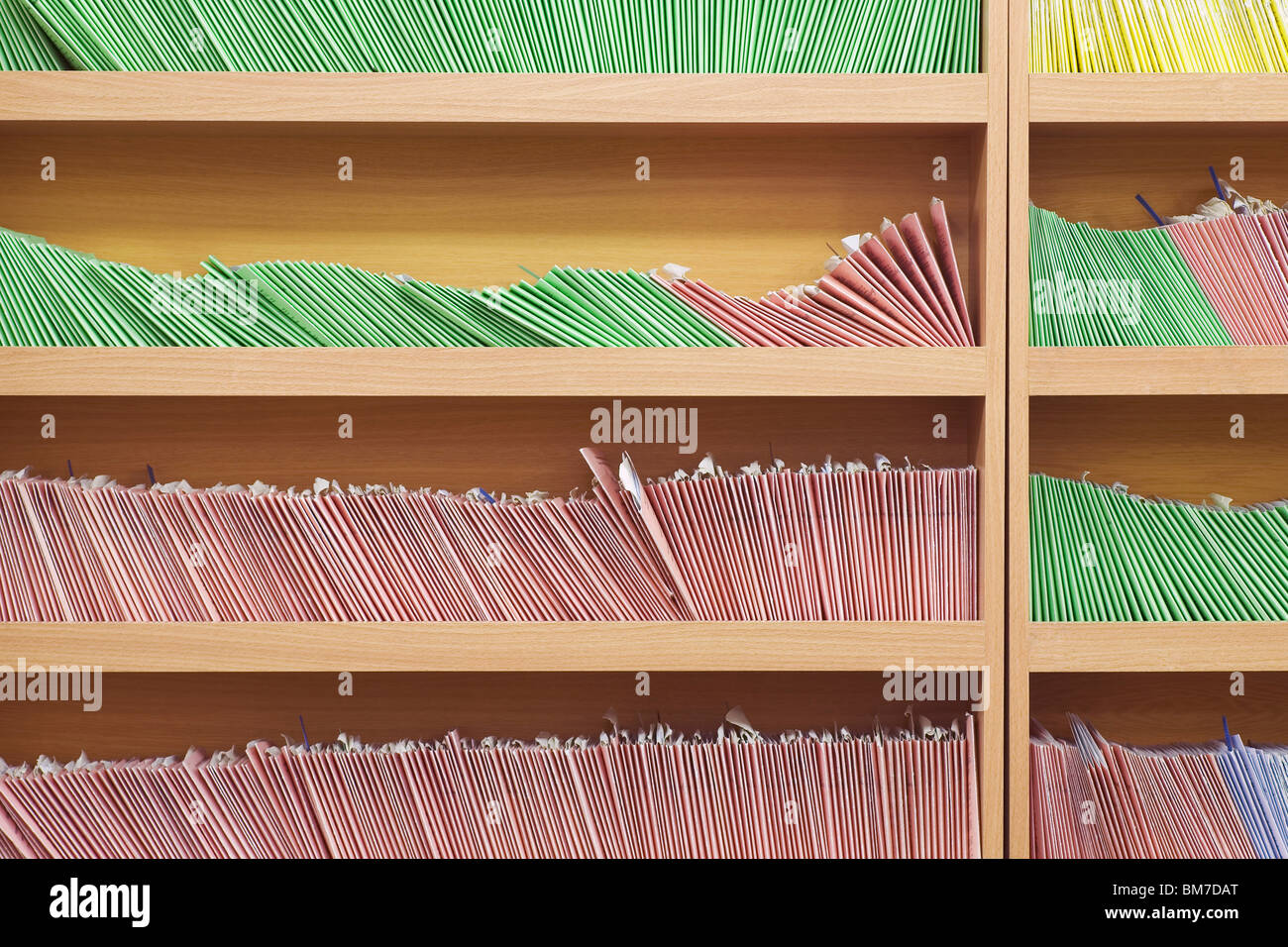 Bookshelves with rows of paperbacks Stock Photo - Alamy