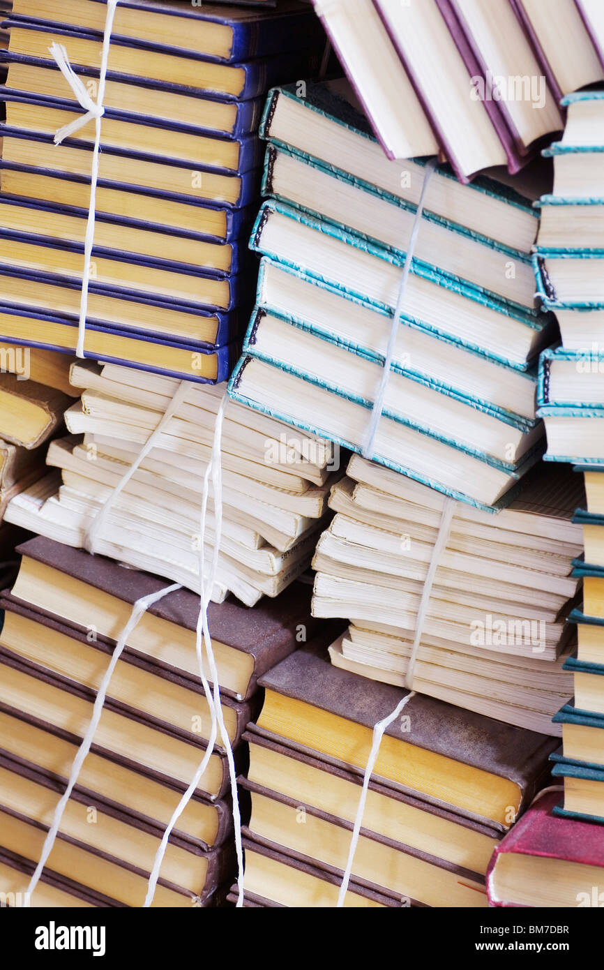 Stacks of tied up books Stock Photo - Alamy