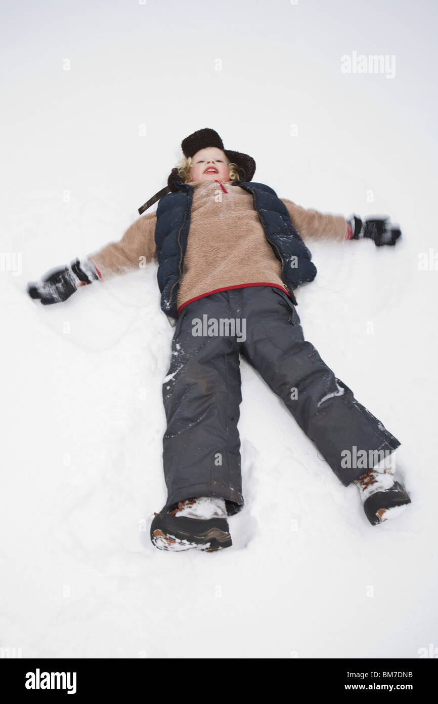 A child making a snow angel Stock Photo - Alamy