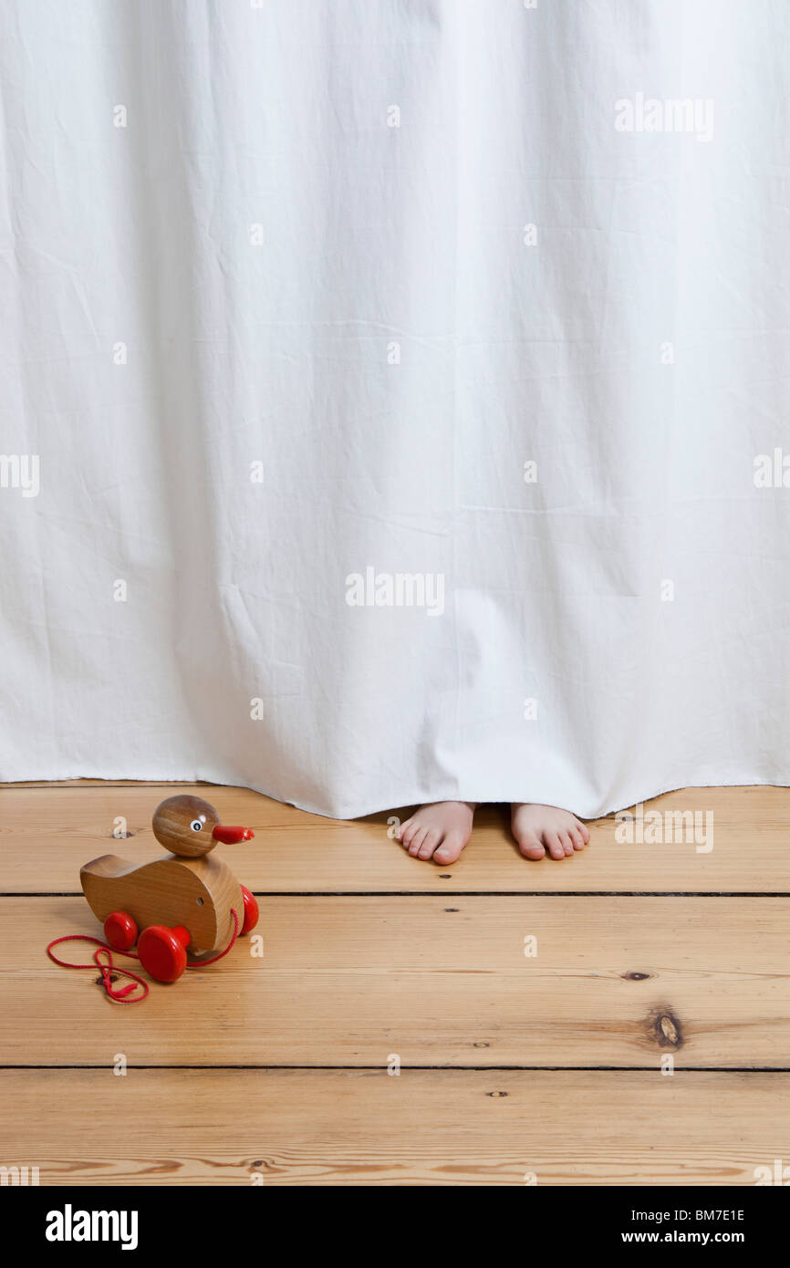 Child feet curtain hi-res stock photography and images - Alamy