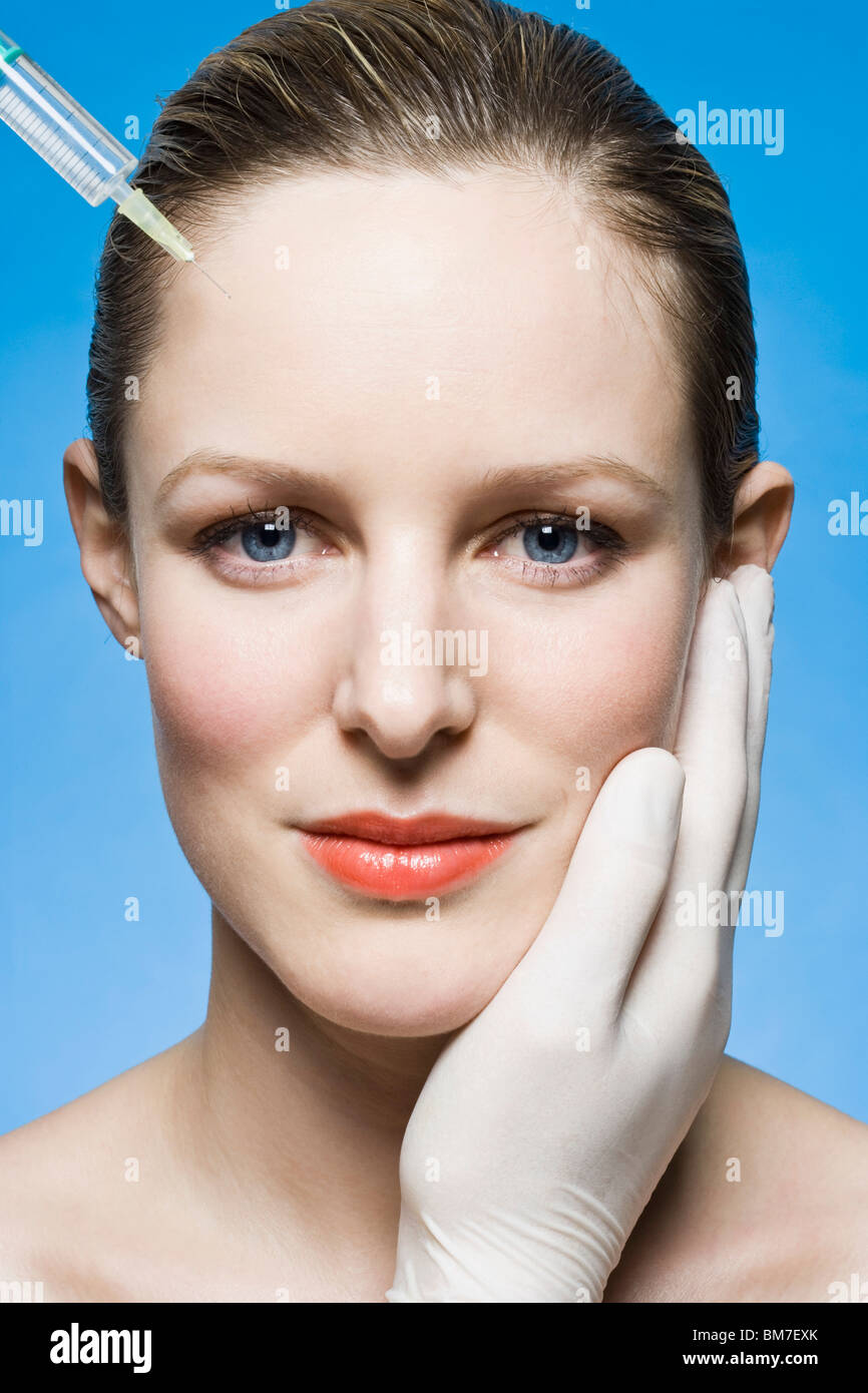 A woman receiving a Botox injection Stock Photo - Alamy