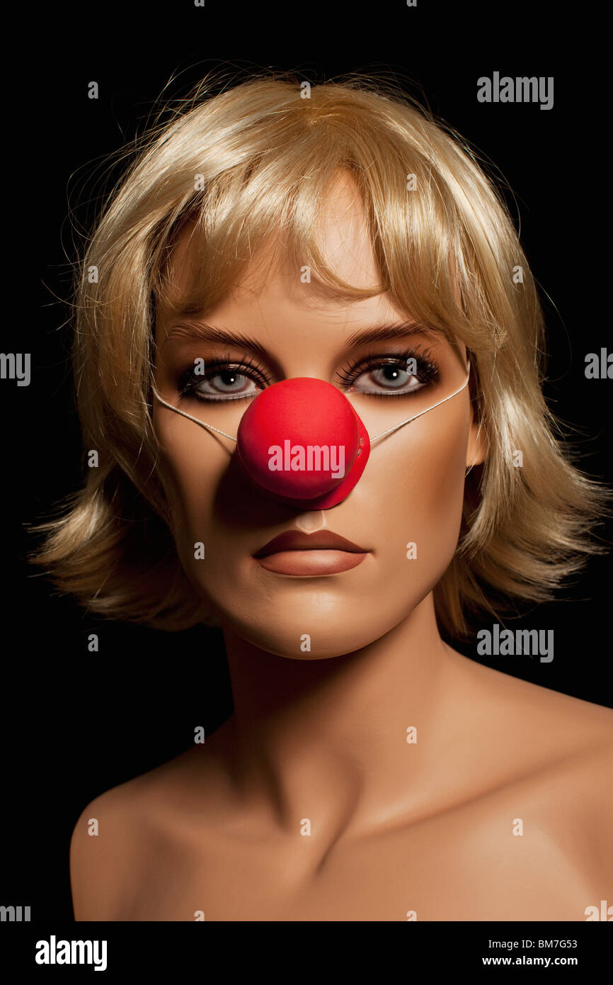 A mannequin wearing a blond wig and a clown's nose Stock Photo - Alamy