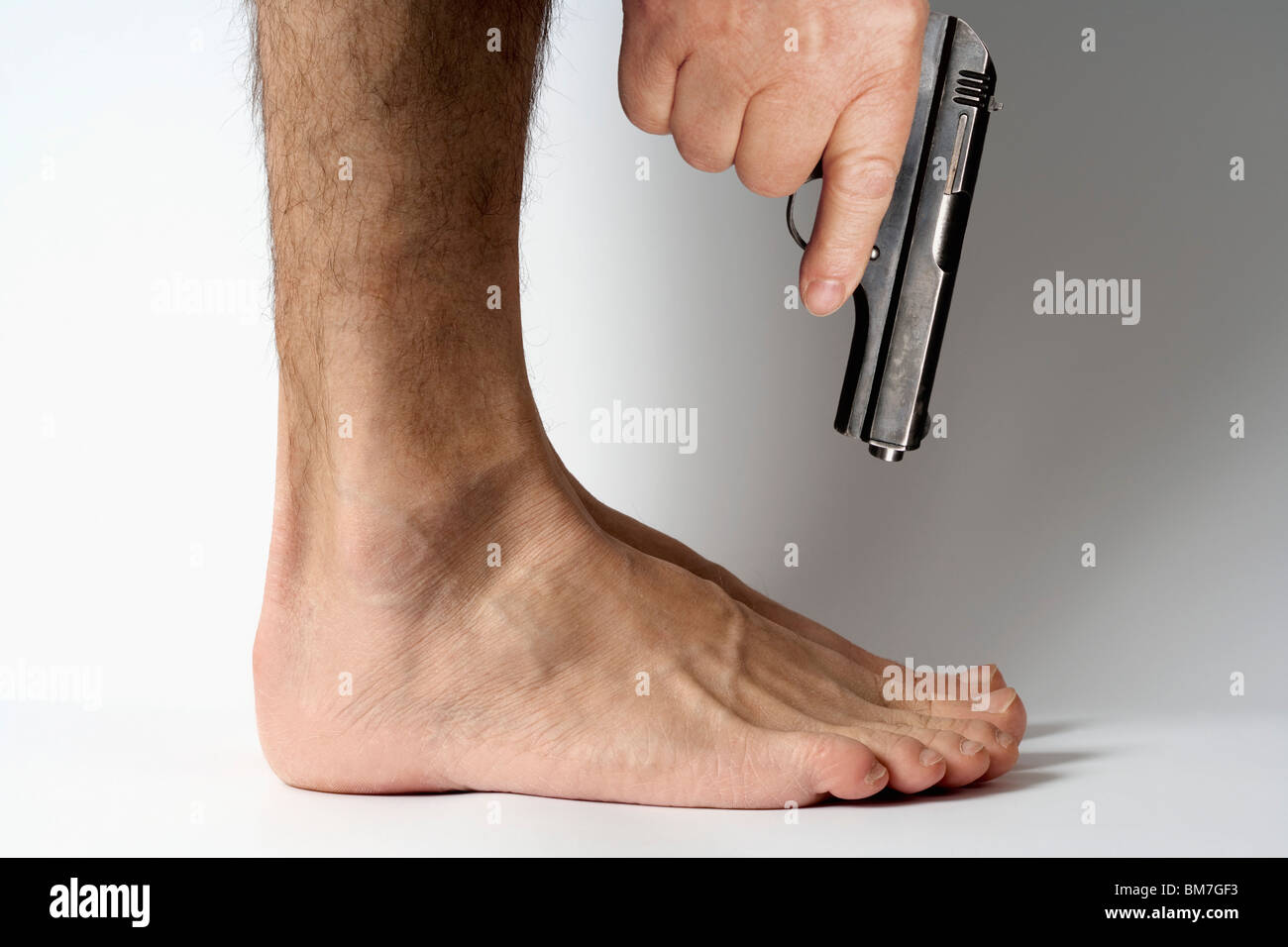 Shoot yourself in the foot hi-res stock photography and images - Alamy