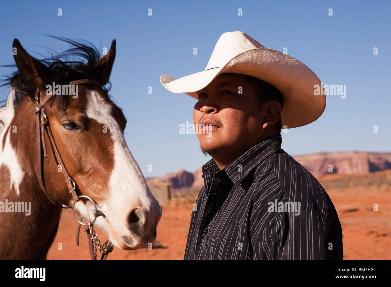 A cowboy and horse, Monument Valley Navajo Tribal Park, Monument Valley ...