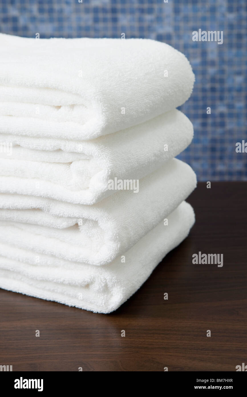 A stack of folded towels Stock Photo - Alamy