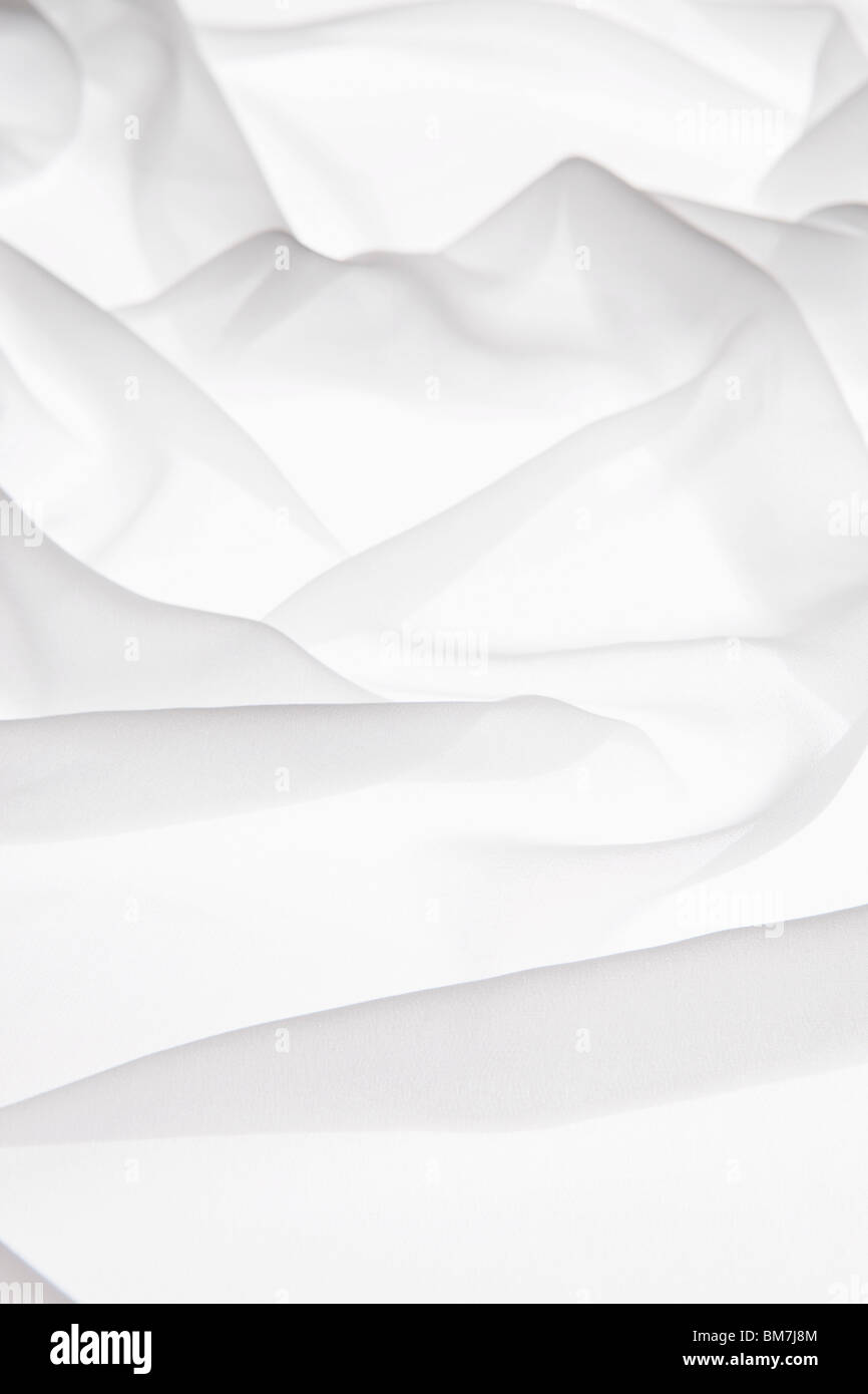 Detail of white fabric draped on a light box Stock Photo - Alamy