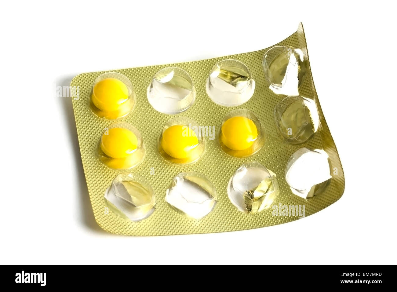 Yellow pills isolated on white background Stock Photo - Alamy