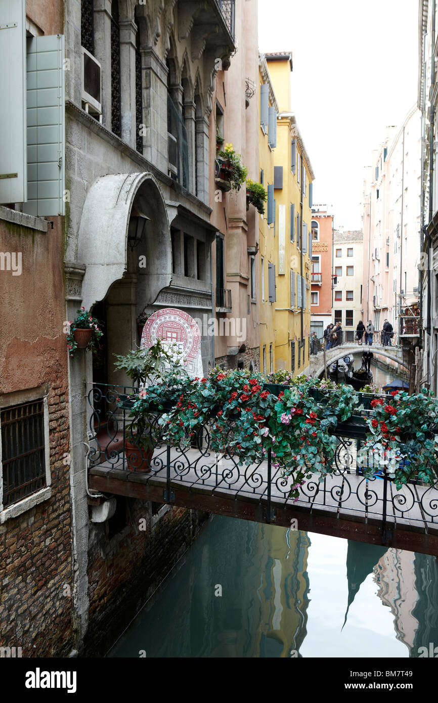 Beautiful bridge with flowers in Venice, Italy Stock Photo - Alamy